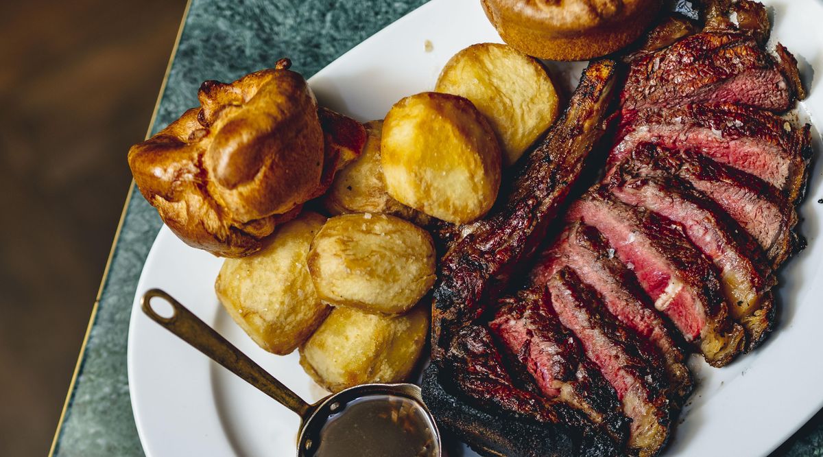 Sharing Sunday Roast with a glass of wine, for two - The Coal Shed London